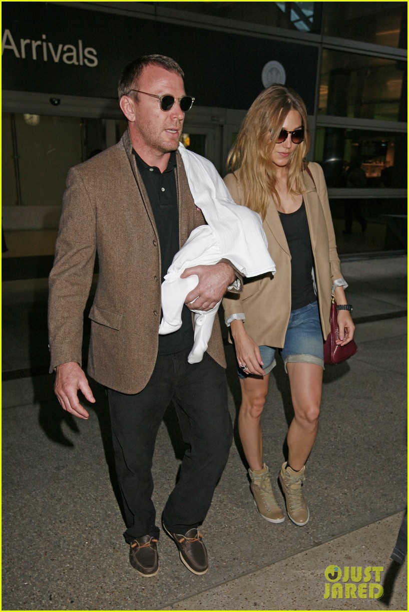 Guy Ritchie Carries His Son Through LAX: Photo 2586779 | Celebrity ...