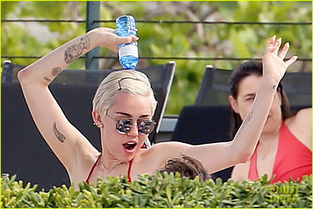 Miley Cyrus Displays Her Amazing Bikini Body, Douses Herself with Water ...