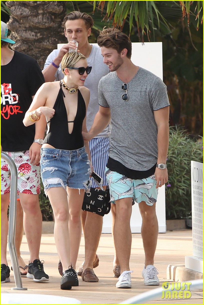 Miley Cyrus & Patrick Schwarzenegger Get Flirty Poolside in Miami with ...