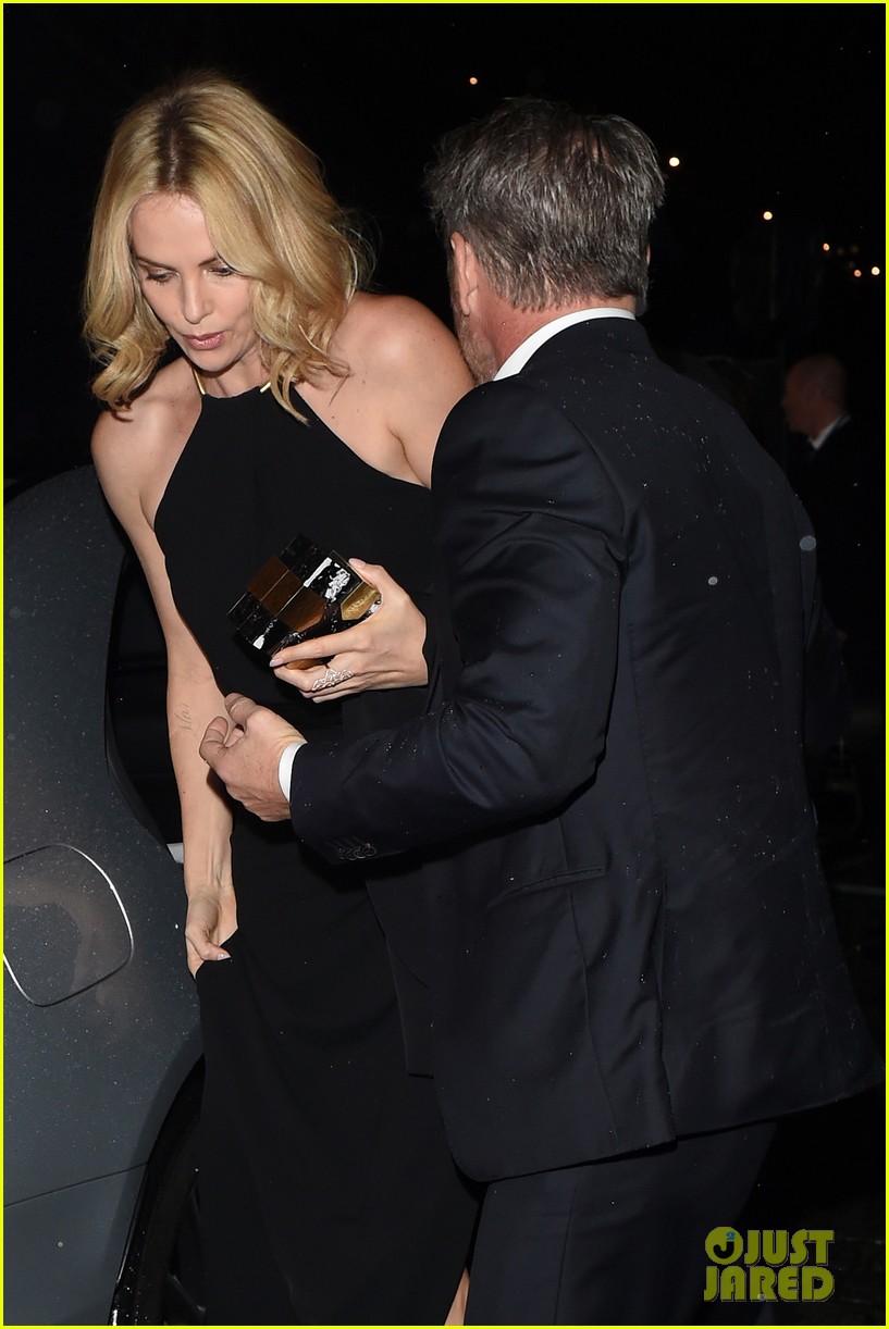 Charlize Theron Gets Doting Look From Sean Penn at 'Gunman' Premiere ...