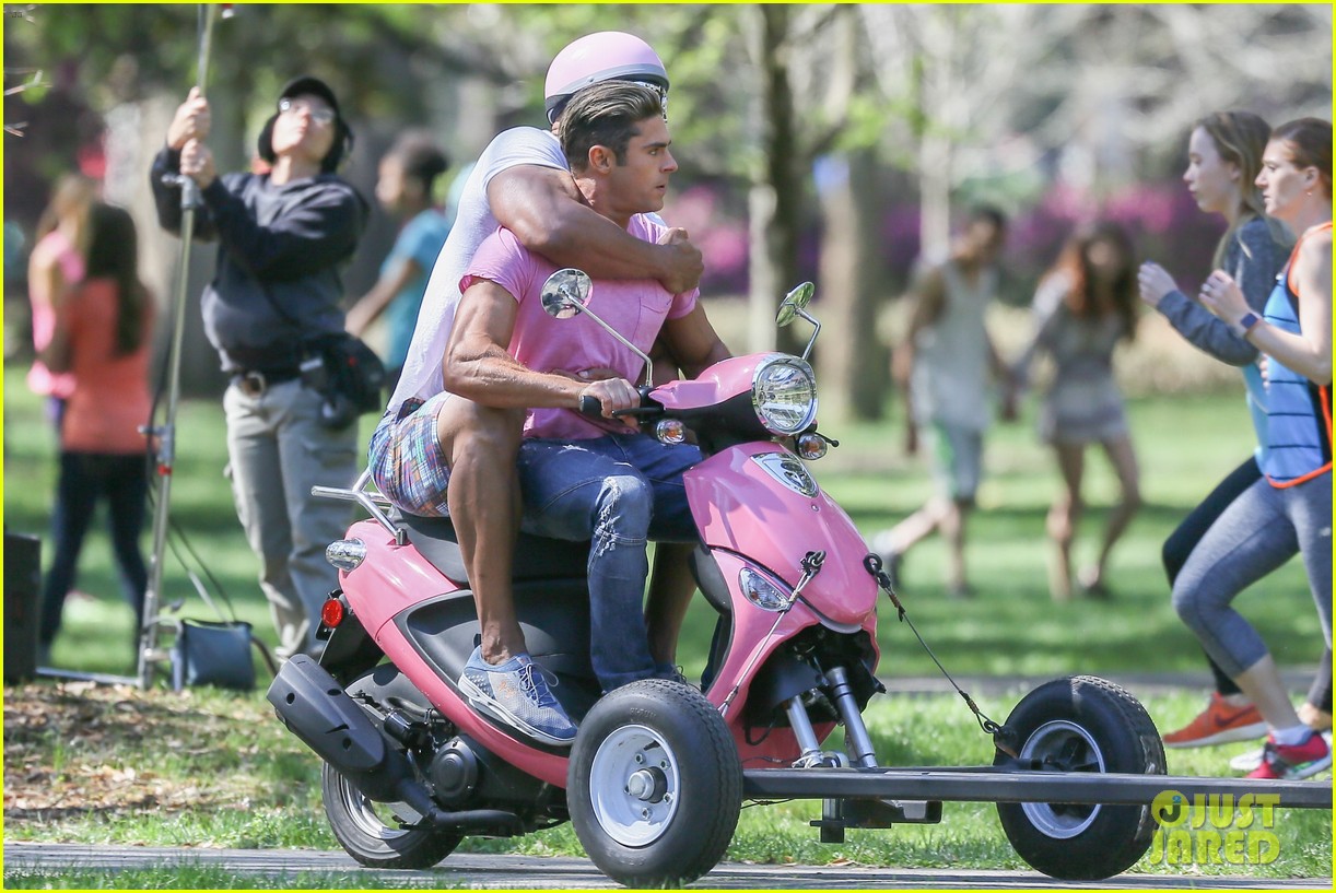 Zac Efron & Dwayne Johnson Take a Ride on a Hot Pink Scooter on ...