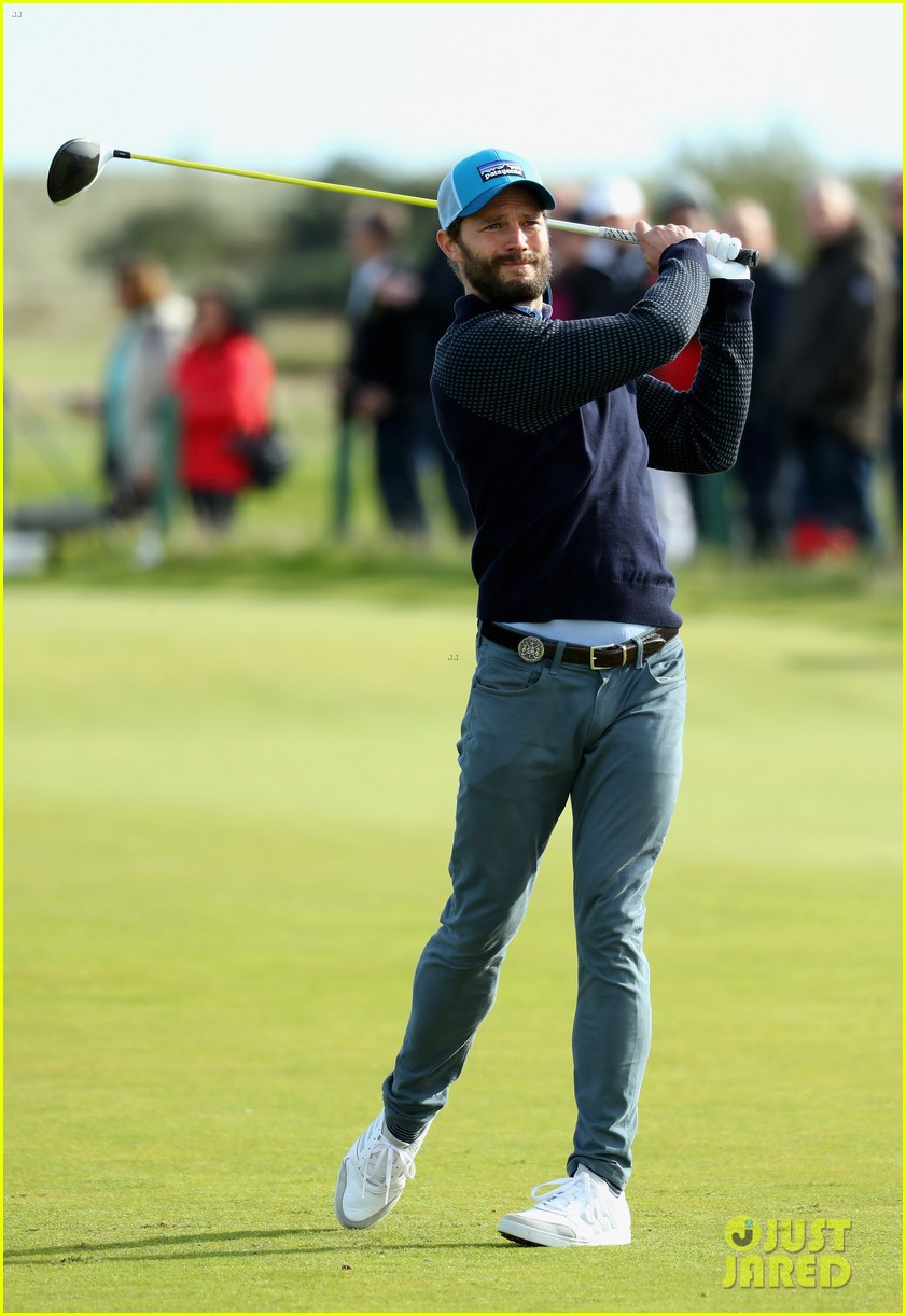 Jamie Dornan Hits Out of the Bunker During Day Three of Golf Tournament ...