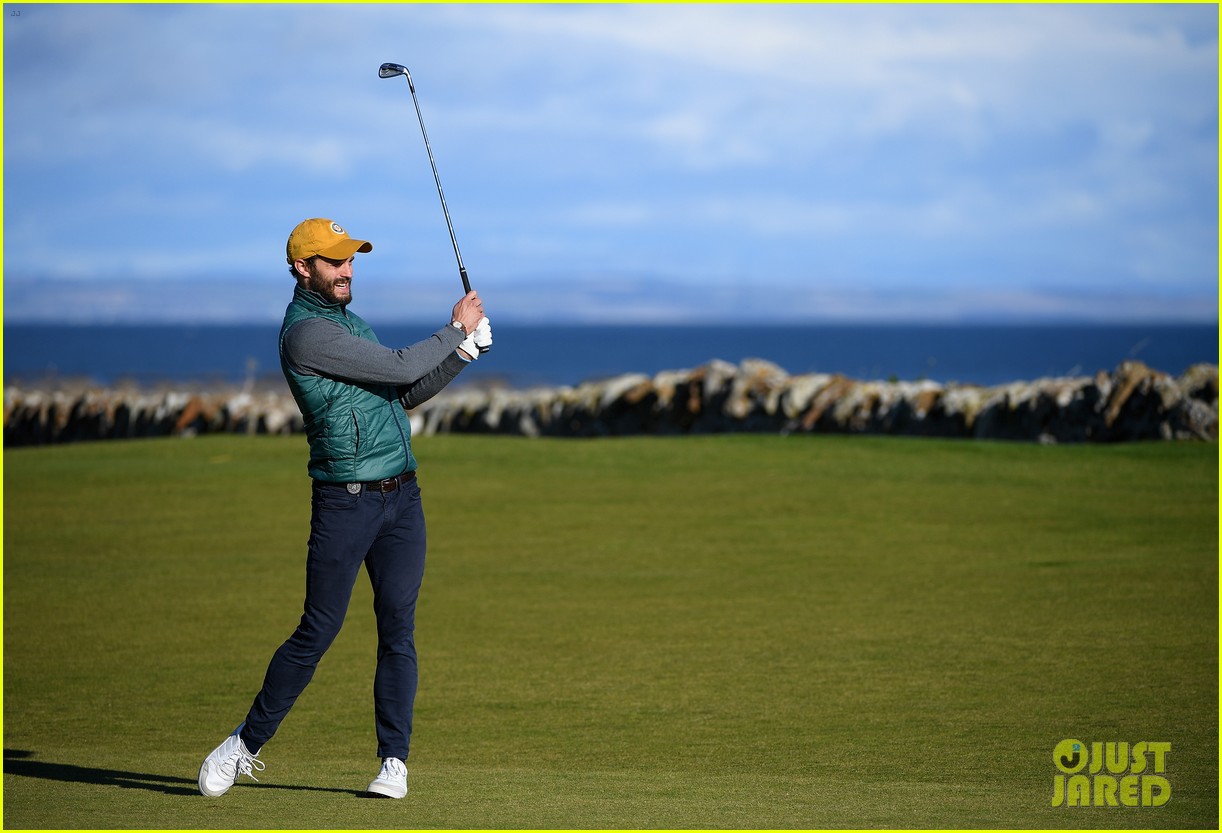 Jamie Dornan Hits Out of the Bunker During Day Three of Golf Tournament ...