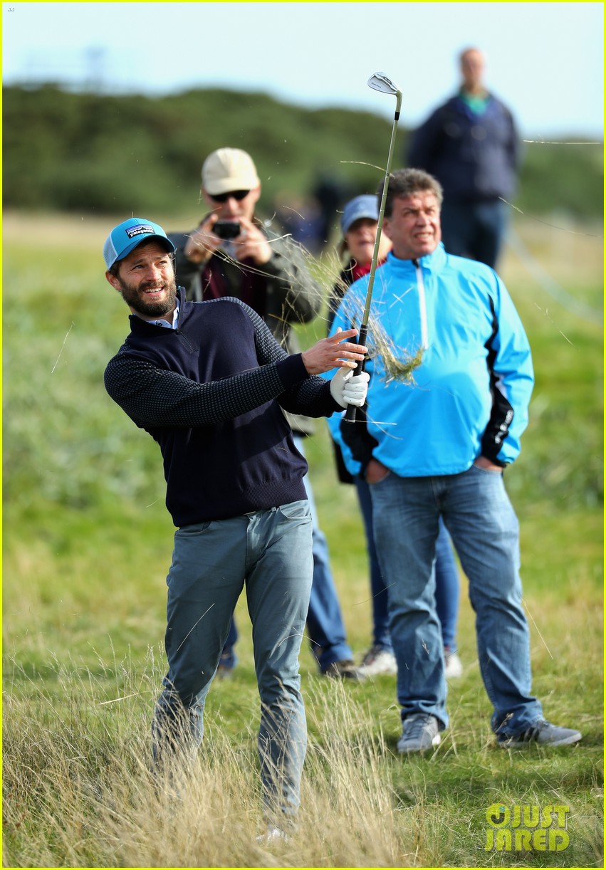 Jamie Dornan Hits Out of the Bunker During Day Three of Golf Tournament ...