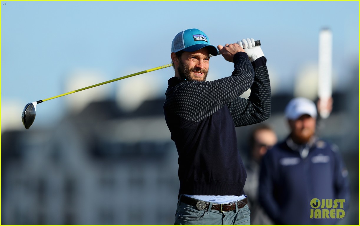 Jamie Dornan Hits Out of the Bunker During Day Three of Golf Tournament ...