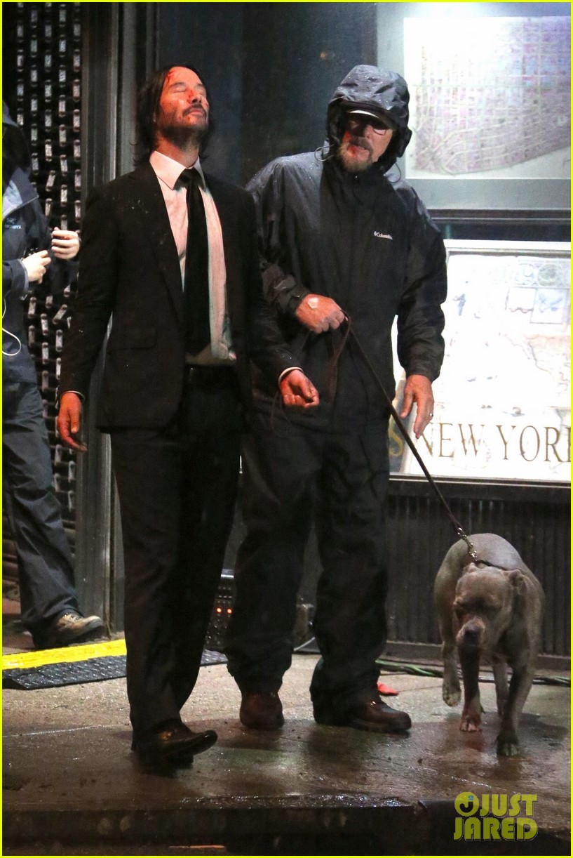 Photo: keanu reeves gets caught in the rain again for john wick 10 ...