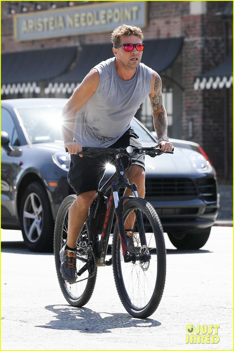 Ryan Phillippe Bares Tattooed Muscles on Bike Ride with Son Deacon ...