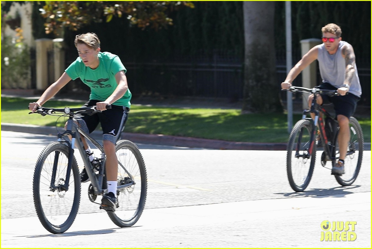 Ryan Phillippe Bares Tattooed Muscles on Bike Ride with Son Deacon ...