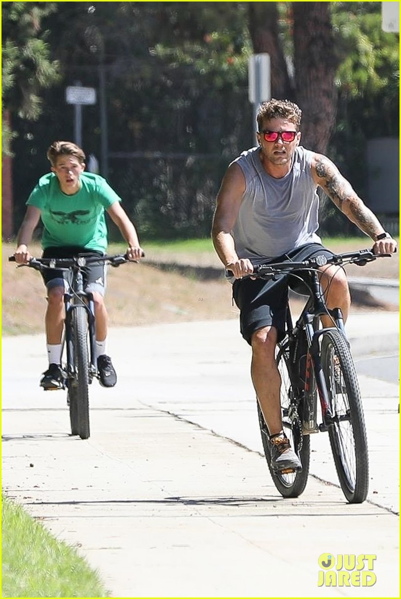Ryan Phillippe Bares Tattooed Muscles on Bike Ride with Son Deacon ...