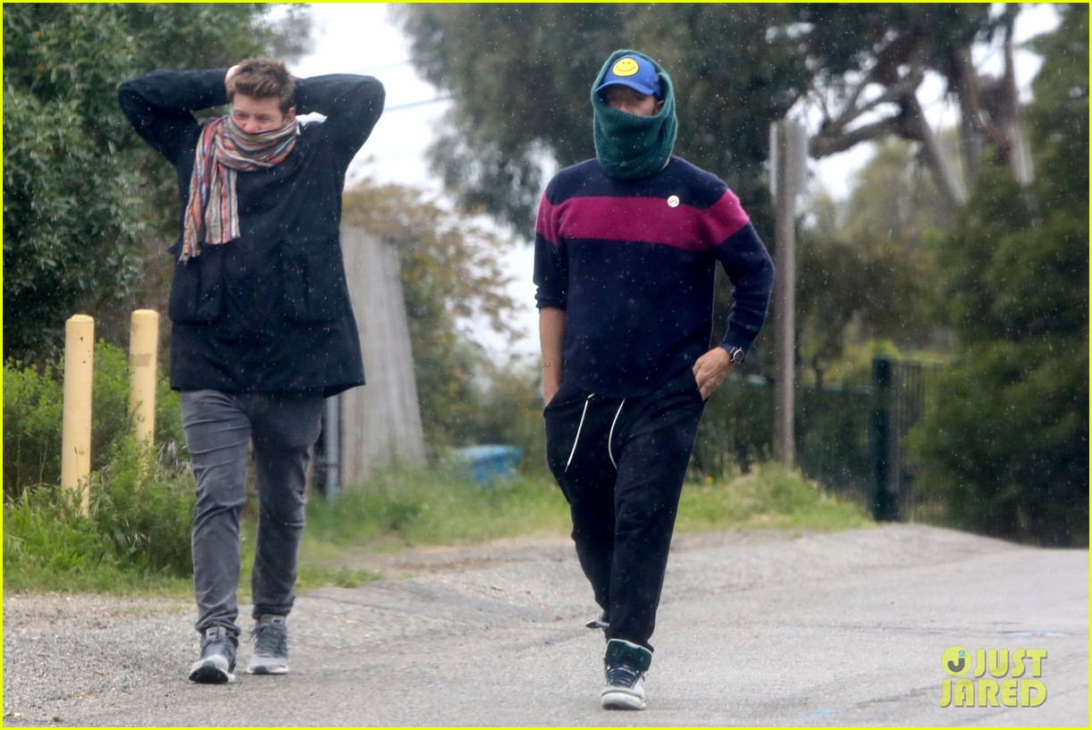 Chris Martin Covers Up in a Scarf While on a Stroll With a Friend Amid ...