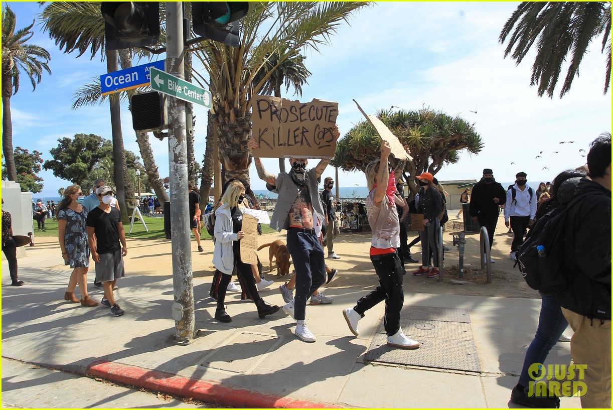 Machine Gun Kelly Holds 'Prosecute Killer Cops' Sign During Protest in ...