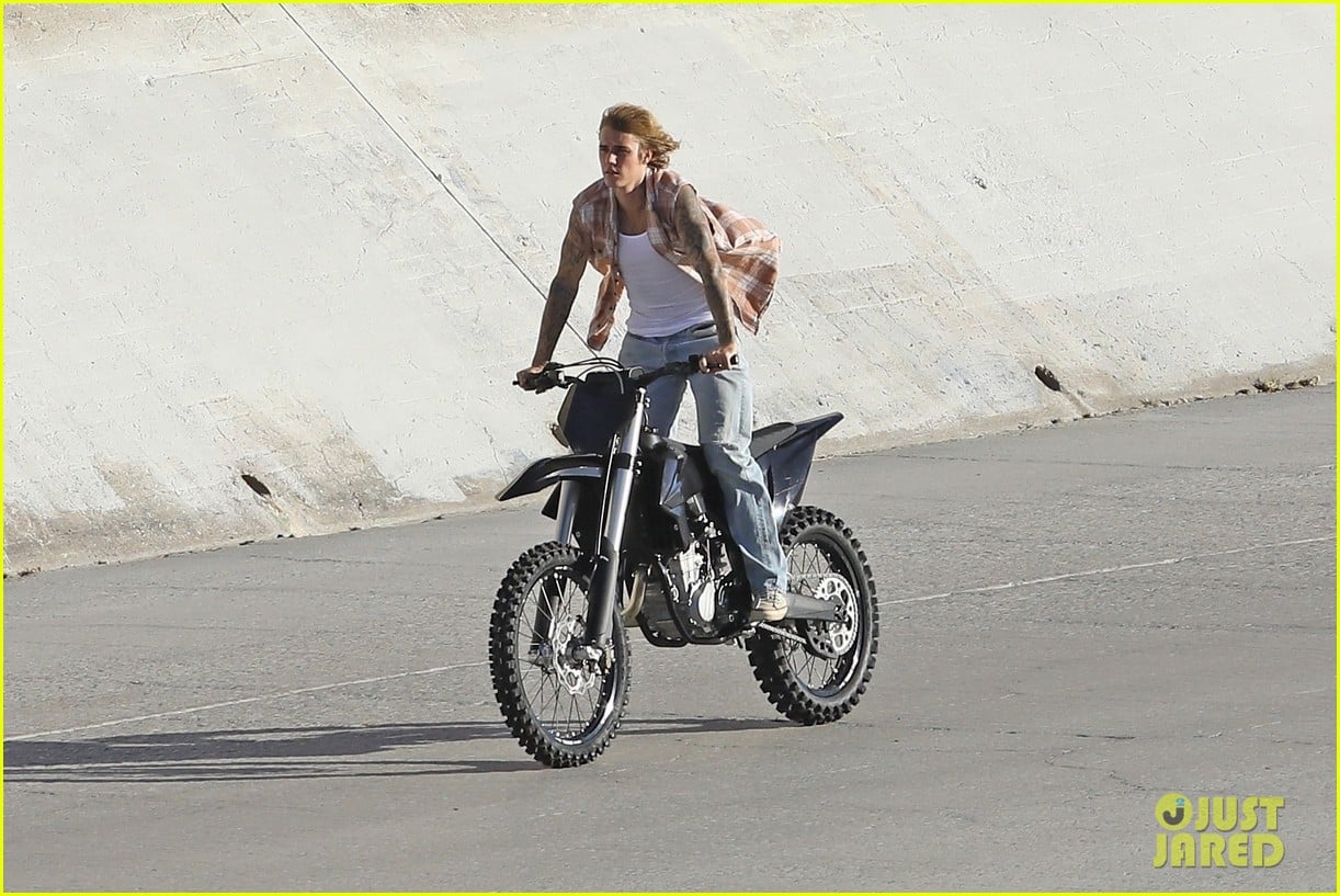 Justin Bieber Rides a Motorcycle While Seemingly Filming a New Music ...