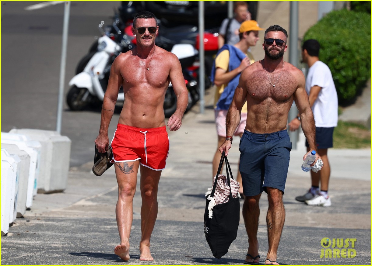 Luke Evans Shows Off New Leg Tattoo in Tiny Bathing Suit During Trip to ...