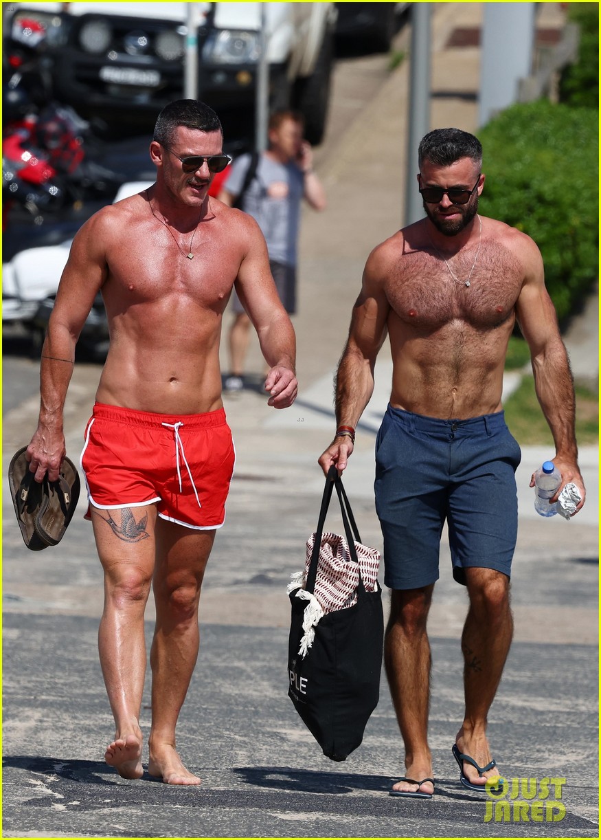 Luke Evans Shows Off New Leg Tattoo in Tiny Bathing Suit During Trip to ...