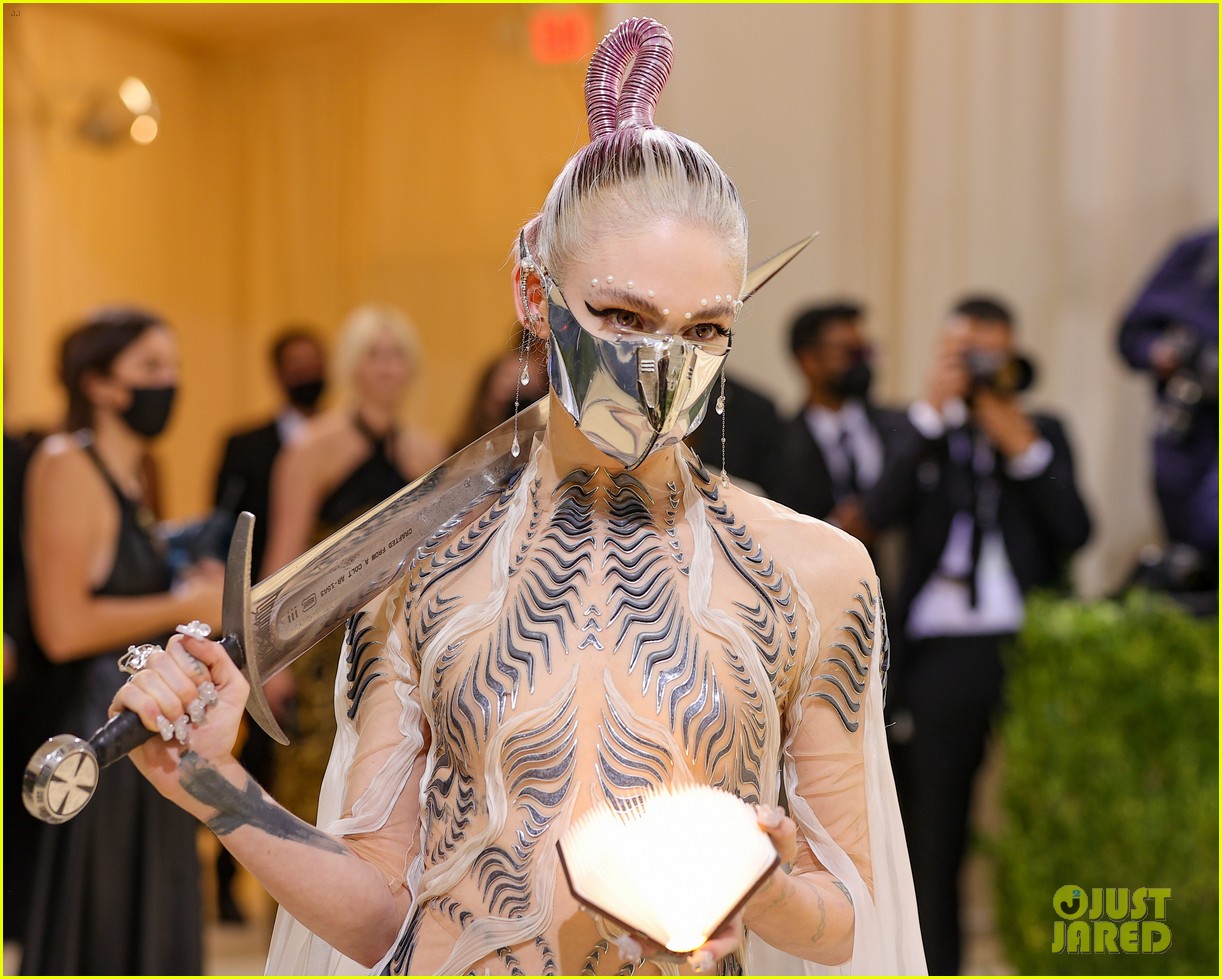 Grimes Explains Viral Photos Trolling Paparazzi While Reading 'The ...