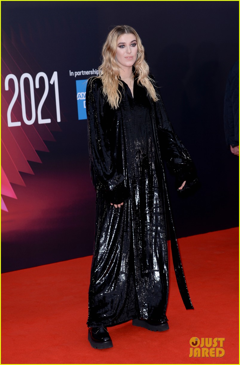 Honor Swinton Byrne Rocks A Shiny Trench Look For 'The Souvenir: Part ...