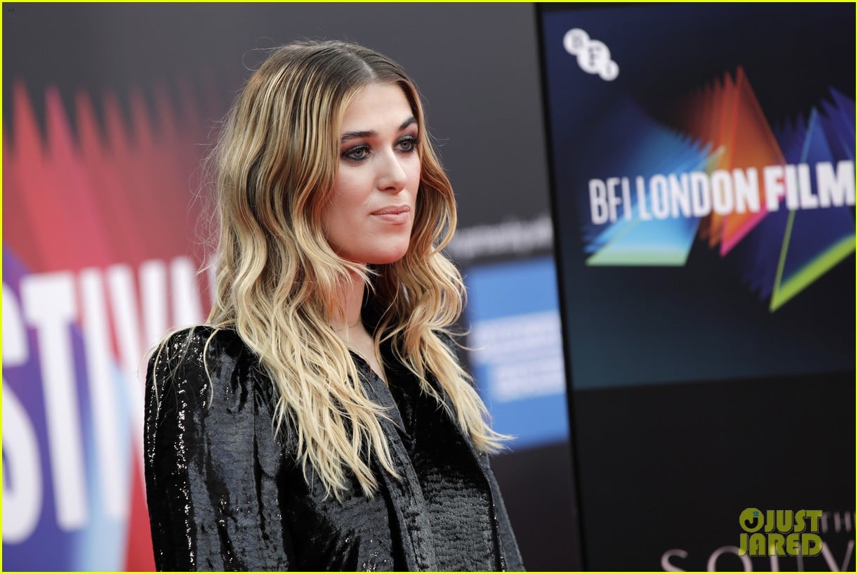 Honor Swinton Byrne Rocks A Shiny Trench Look For 'The Souvenir: Part ...