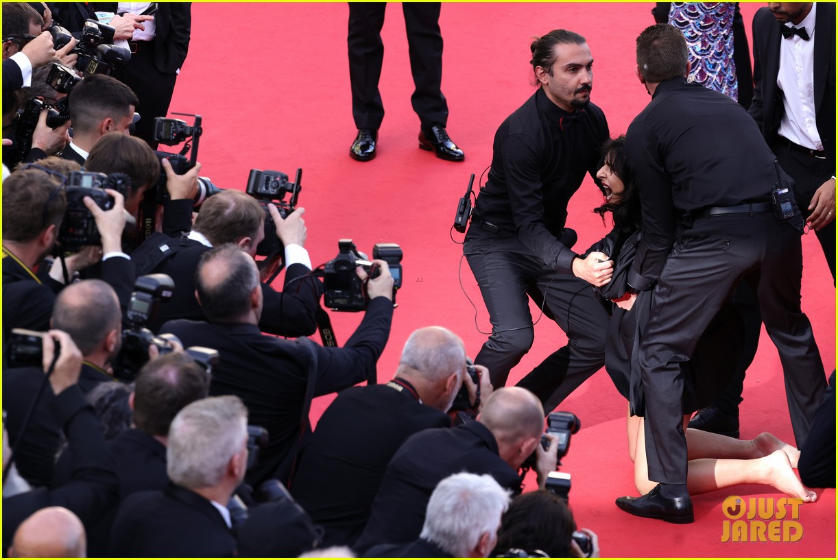 Topless Protester Storms the Red Carpet at Cannes 2022 Premiere - See ...