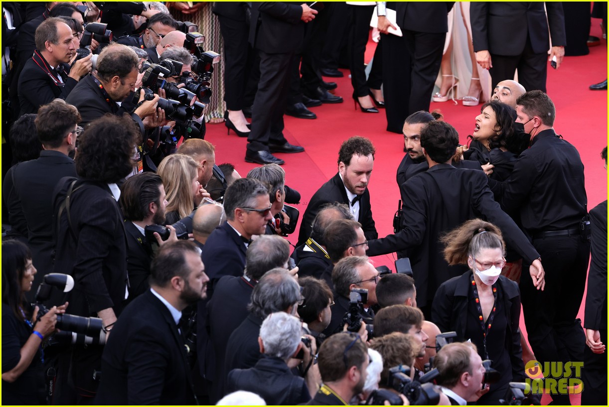Topless Protester Storms the Red Carpet at Cannes 2022 Premiere - See ...