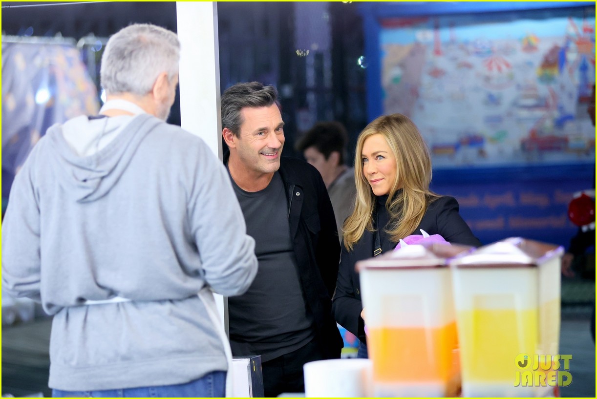 Jon Hamm Wins Jennifer Aniston A Purple Stuffed Toy At The Carnival For ...
