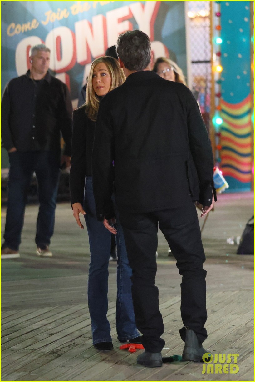 Jon Hamm Wins Jennifer Aniston A Purple Stuffed Toy At The Carnival For ...