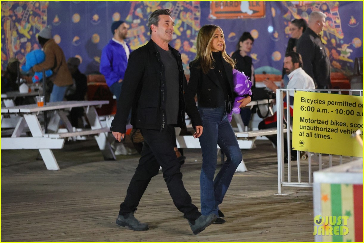 Jon Hamm Wins Jennifer Aniston A Purple Stuffed Toy At The Carnival For ...