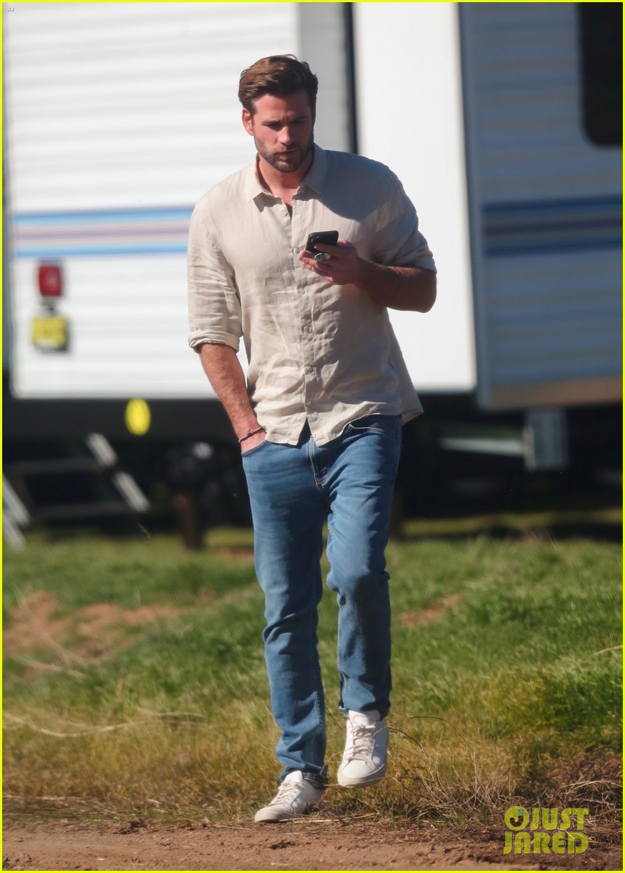 Liam Hemsworth Takes a Break on the Set of 'Lonely Planet': Photo ...