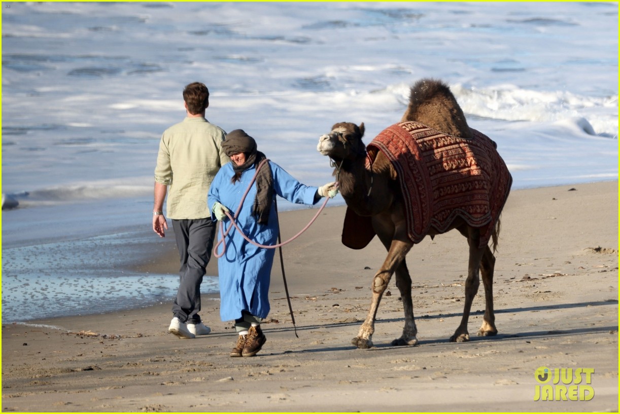 Liam Hemsworth Films New Netflix Movie 'Lonely Planet' with a Camel at ...