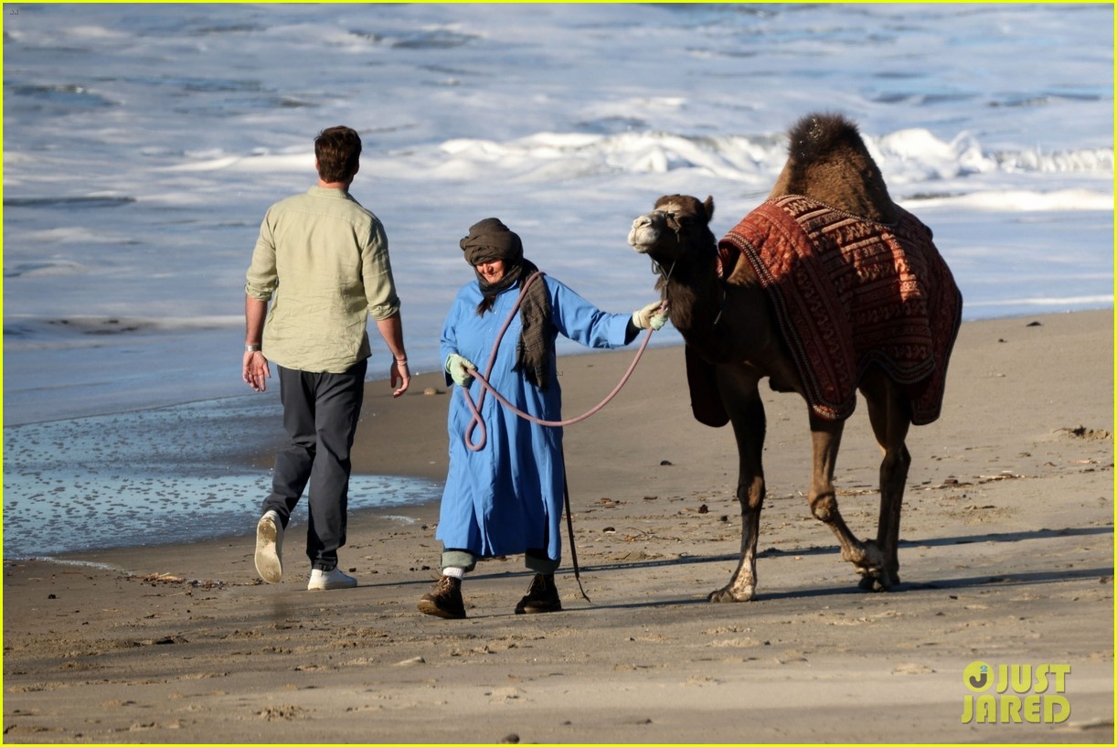 Liam Hemsworth Films New Netflix Movie 'Lonely Planet' with a Camel at ...