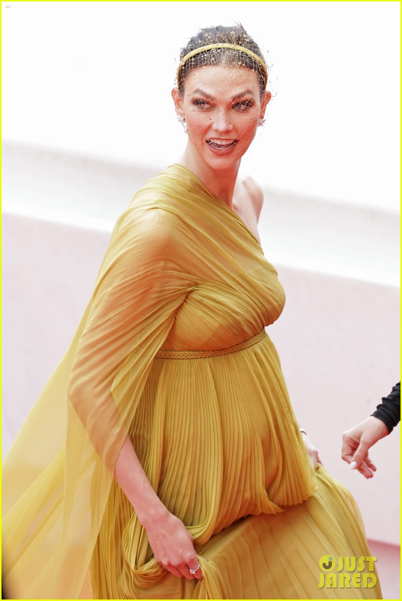 Karlie Kloss Cradles Her Growing Baby Bump While Attending 'Indiana Jones' Premiere at Cannes ...