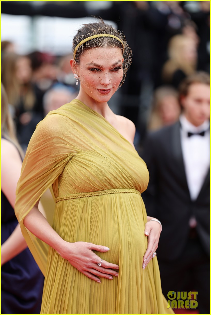Karlie Kloss Cradles Her Growing Baby Bump While Attending 'Indiana Jones' Premiere at Cannes ...