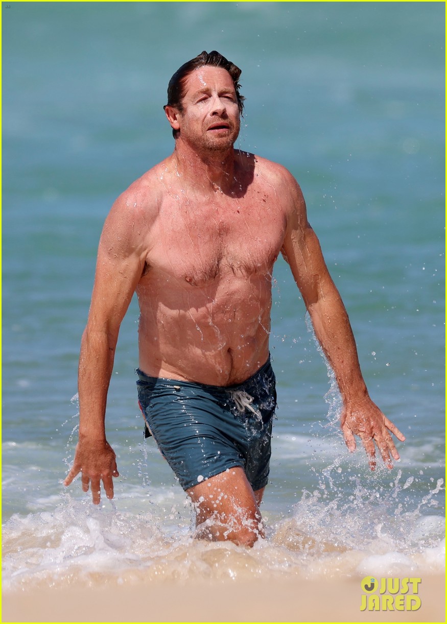Simon Baker Hits the Beach for Shirtless Beach Day with Son Claude ...