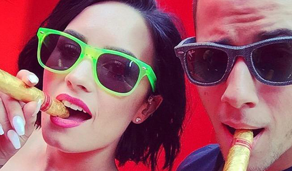 Nick Jonas & Demi Lovato Smoke Cigars to Celebrate ‘Cool For the Summer ...