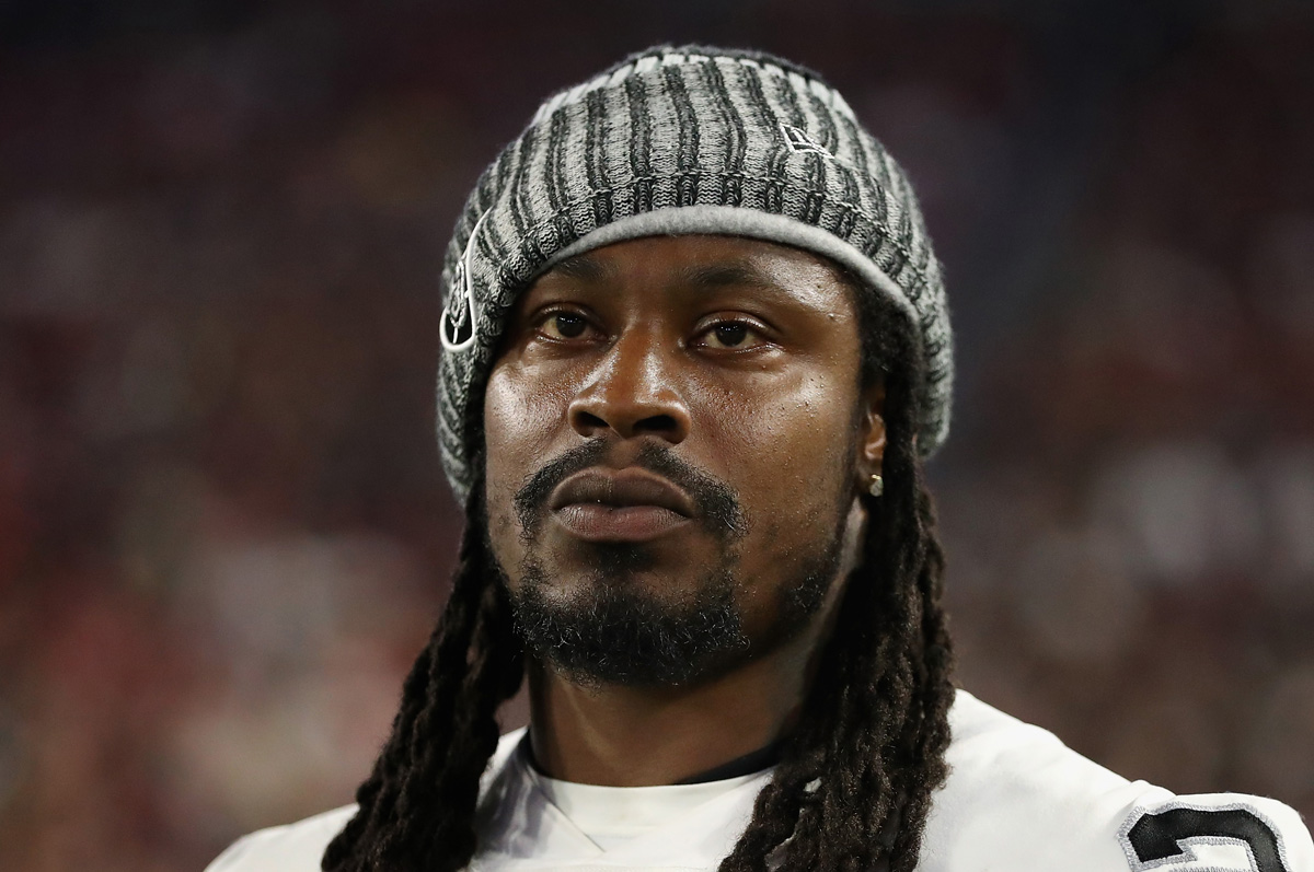 NFL’s Marshawn Lynch Sits for National Anthem, Says He’s Been Doing So ...