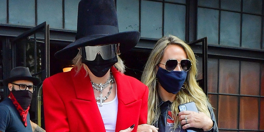 Miley Cyrus Is Fashion Forward In a Top Hat & Red Coat in New York City ...