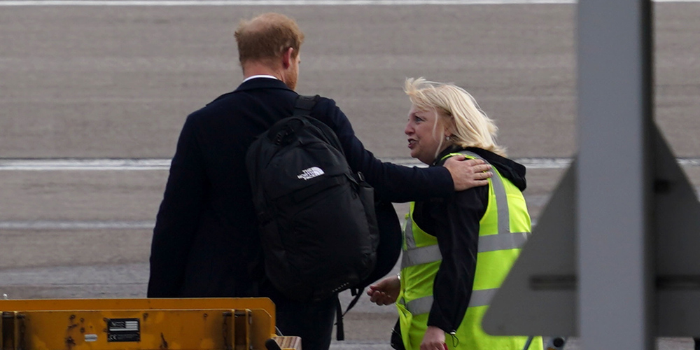 Prince Harry Appears to Comfort Worker While Boarding Flight After ...
